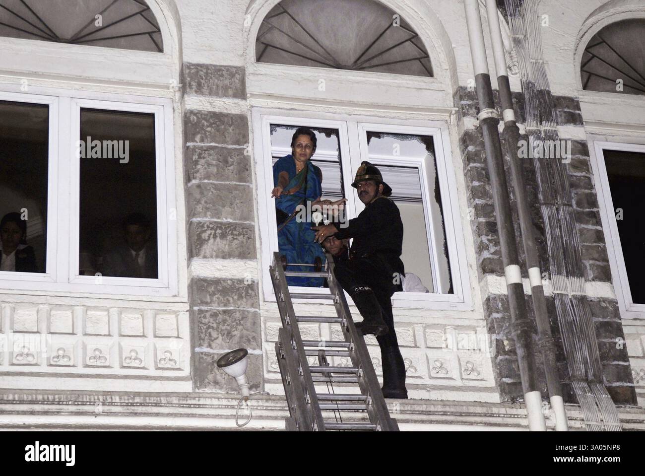 Fire brigade officer ladder rescue tourist window Taj Mahal Hotel ...