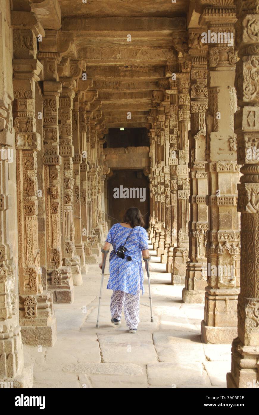 Handicapped lady walking in gallery in Qutab Minar campus, Delhi, India ...