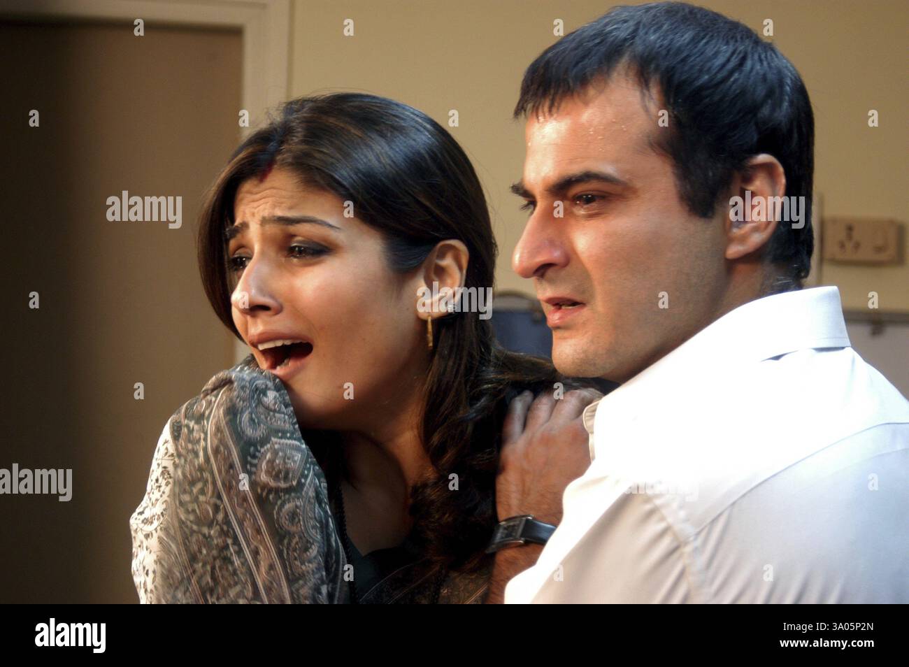 Indian film actor and actress Raveena Tandon and Sanjay Kapoor picturing scene during film shot ...