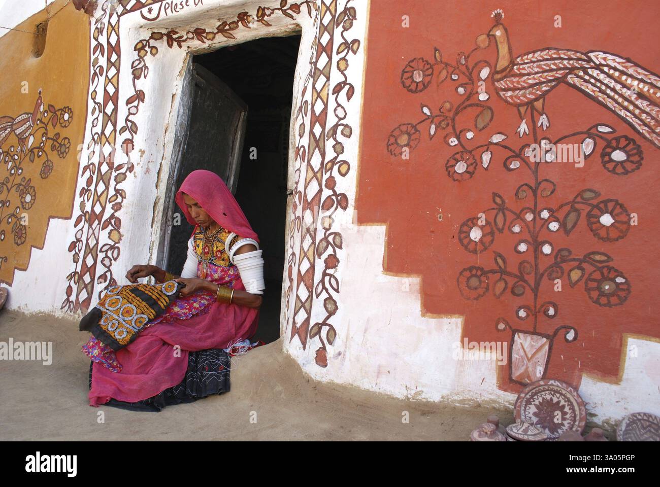 Lady doing embroidery work on cloth, Khuhri, Jaisalmer, Rajasthan ...
