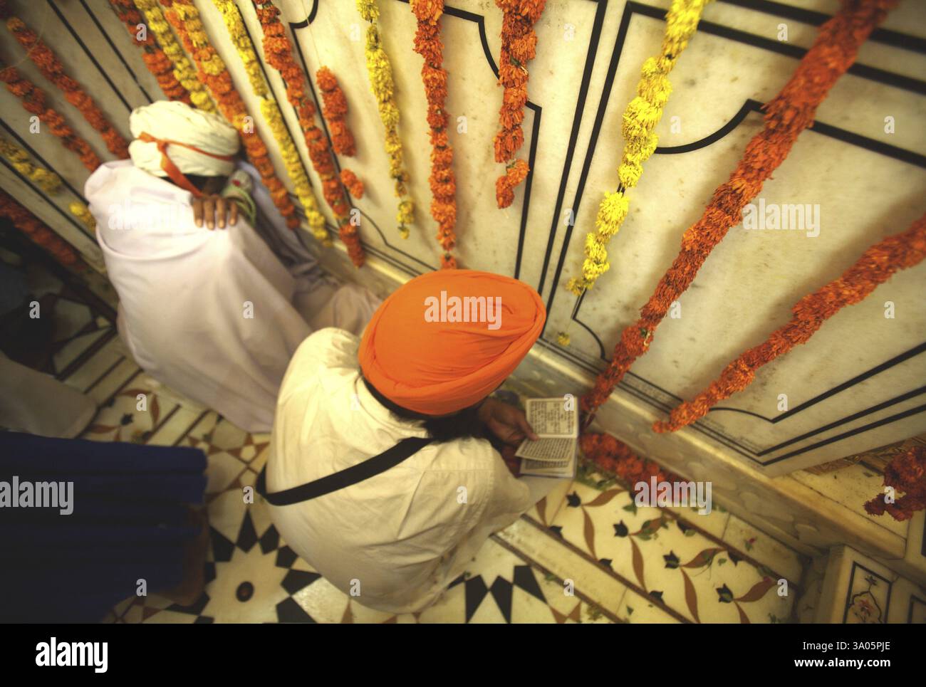 Sikh devotee reading holy scriptures, consecration of perpetual Guru ...
