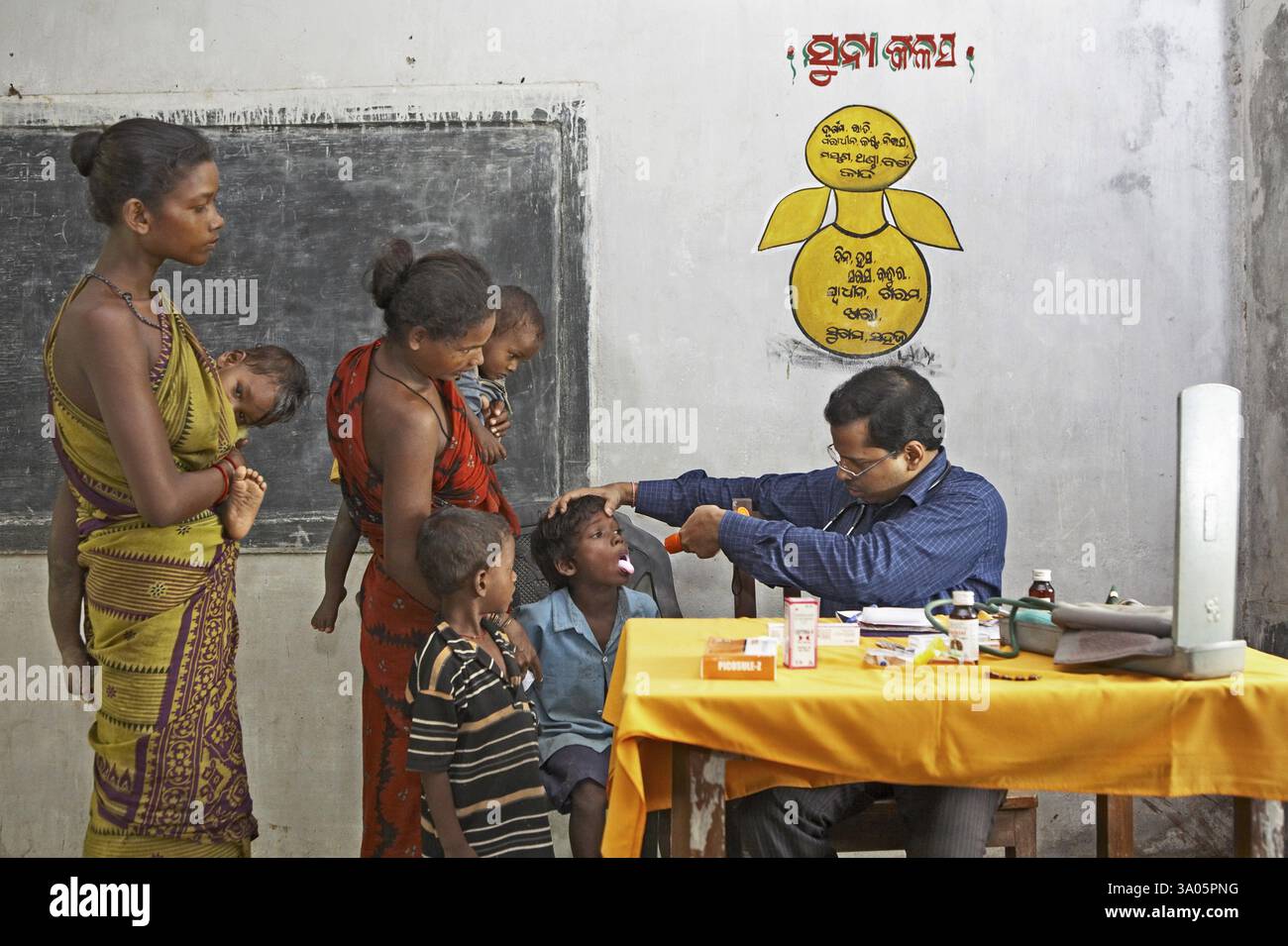 Medical doctor examining health of poor villagers at health check-up ...