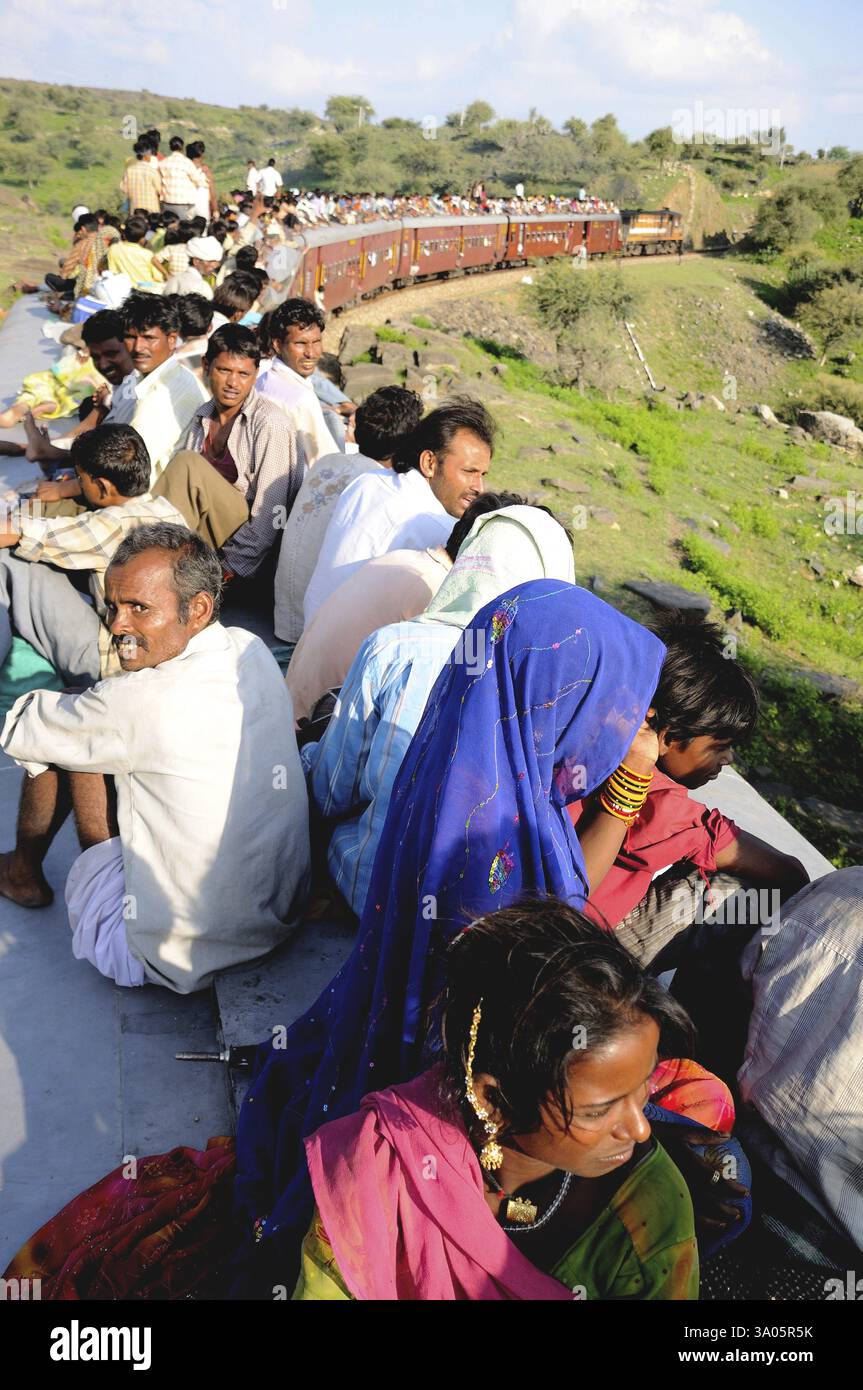 People taking risk while travelling on roof of train, Goram ghat ...