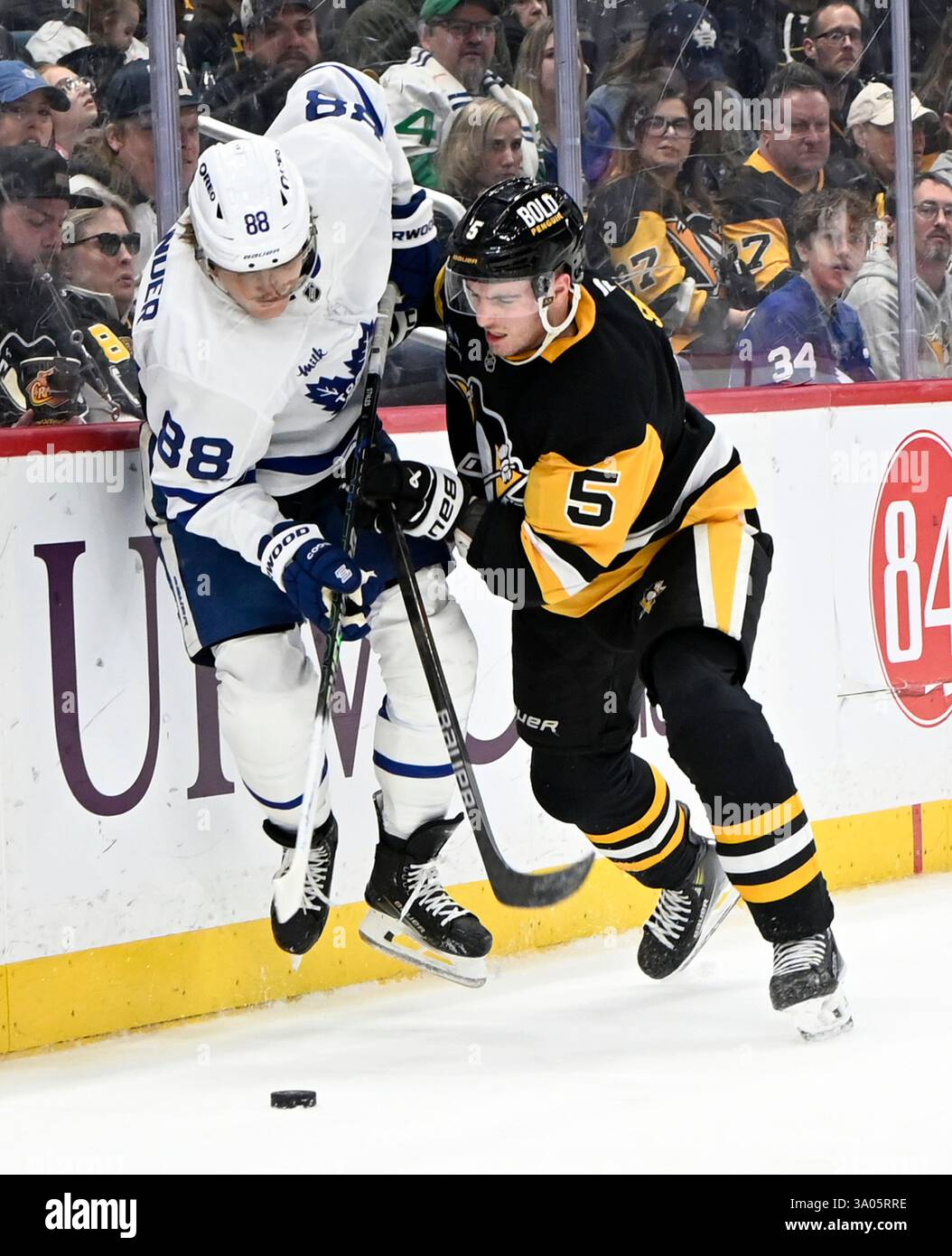 Pittsburgh Penguins defenseman Ryan Shea (5) checks Toronto Maple Leafs ...