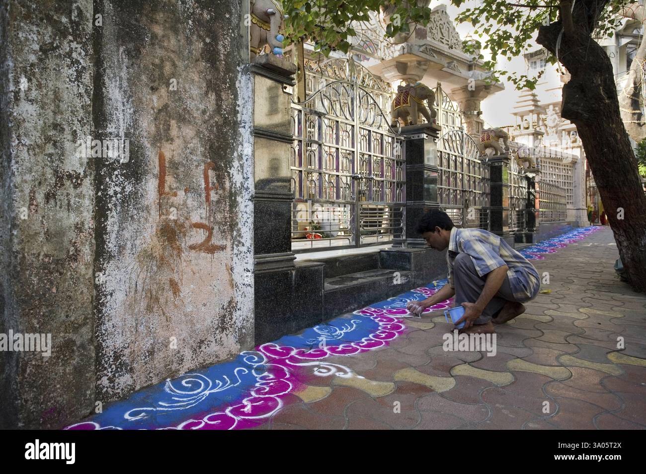 Man doing rangoli hi-res stock photography and images - Alamy