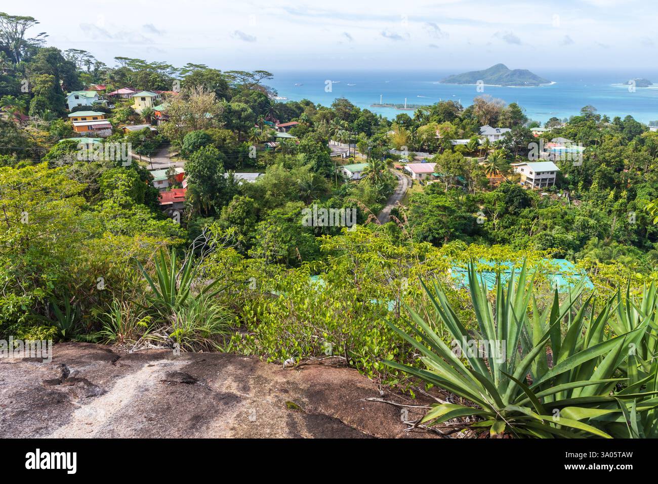 A breathtaking view showcasing a tropical village surrounded by dense ...
