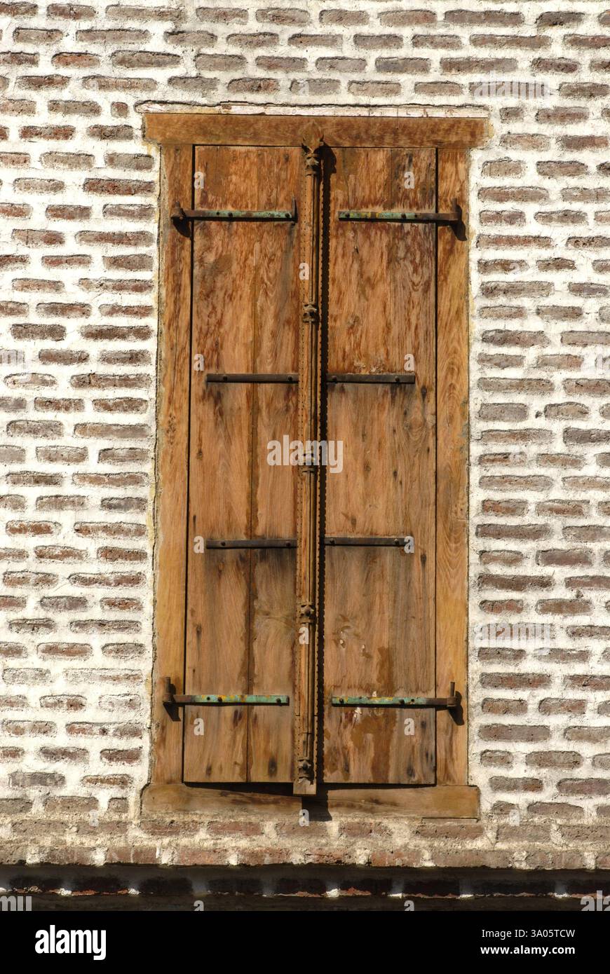 Wooden window fixed in brickwork at entrance of Vishrambaug Wada second ...