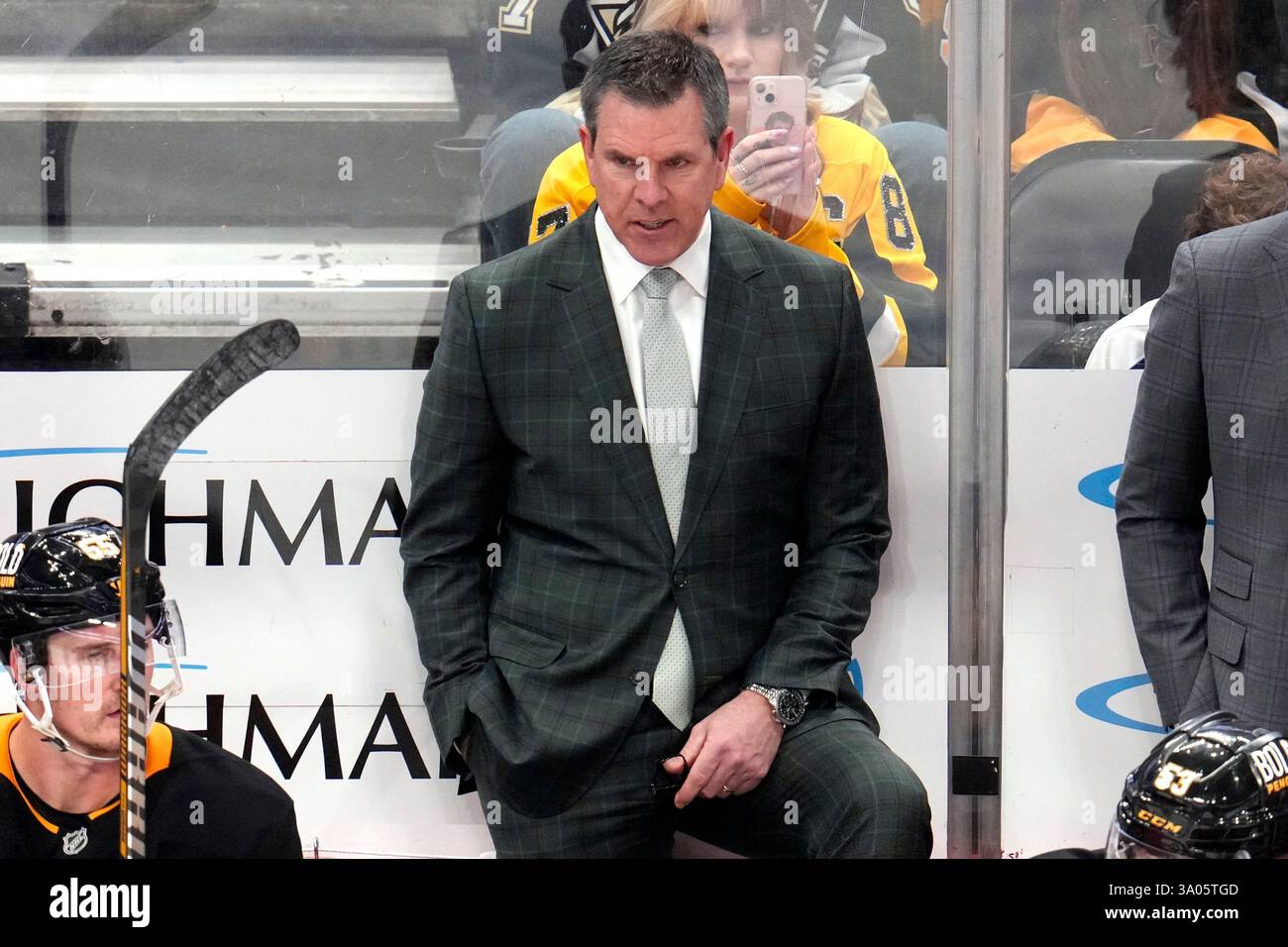 Pittsburgh Penguins head coach Mike Sullivan stands behind his bench ...