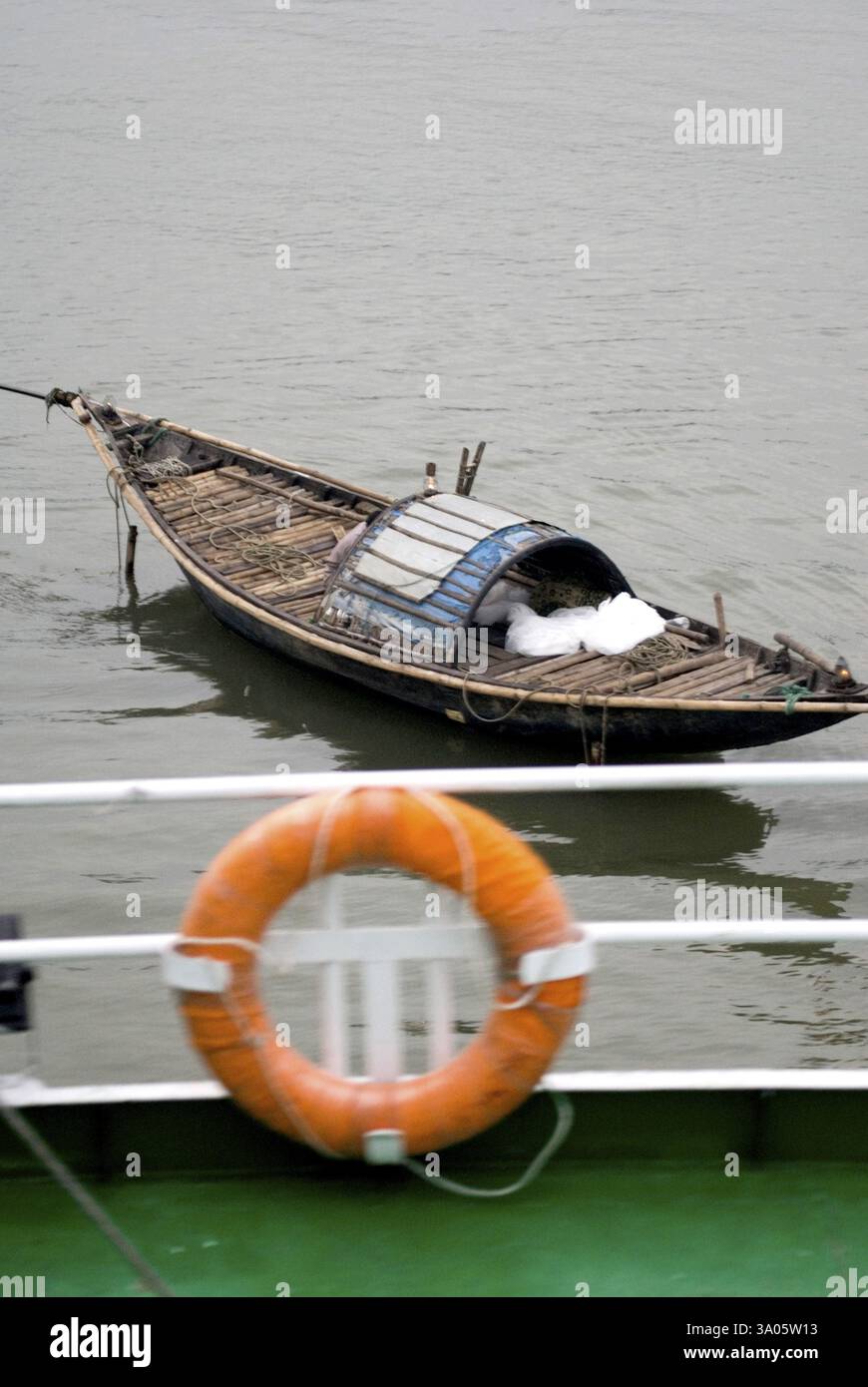 Waterways Ferry and Wooden boat floating in water major form of ...