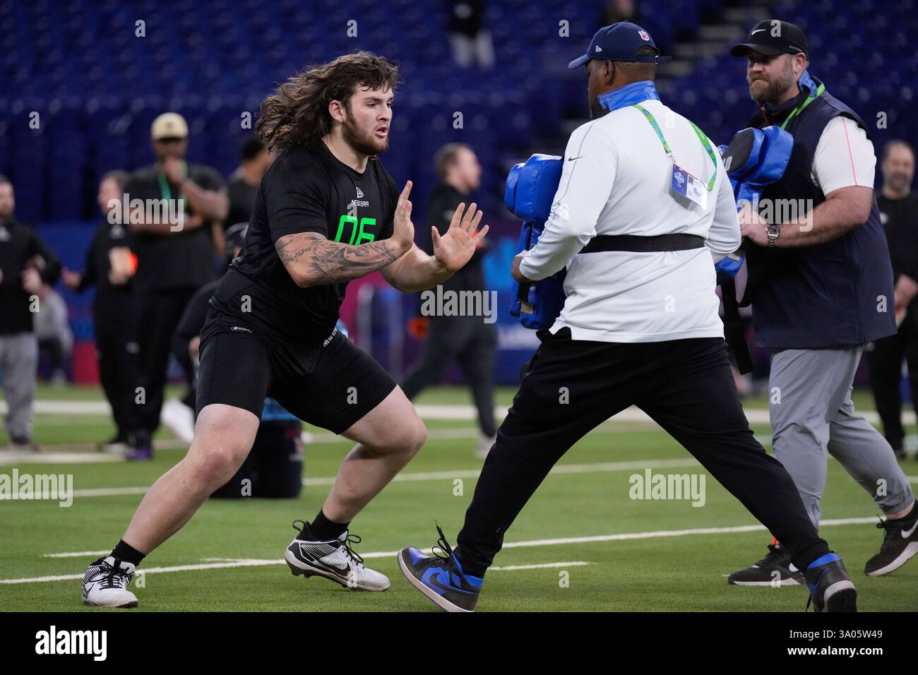 Iowa offensive lineman Connor Colby runs a drill at the NFL football ...