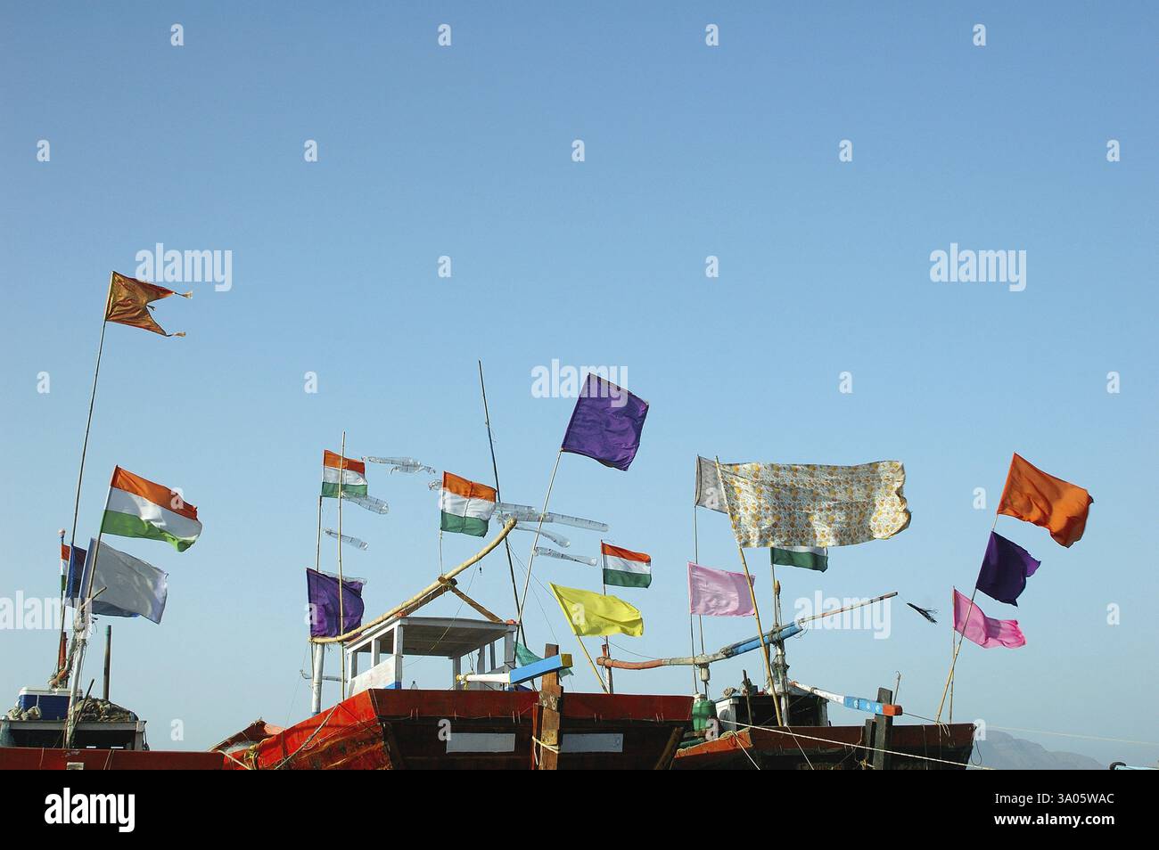Indian flag and other colorful flags on ship and trawlers in Bombay ...