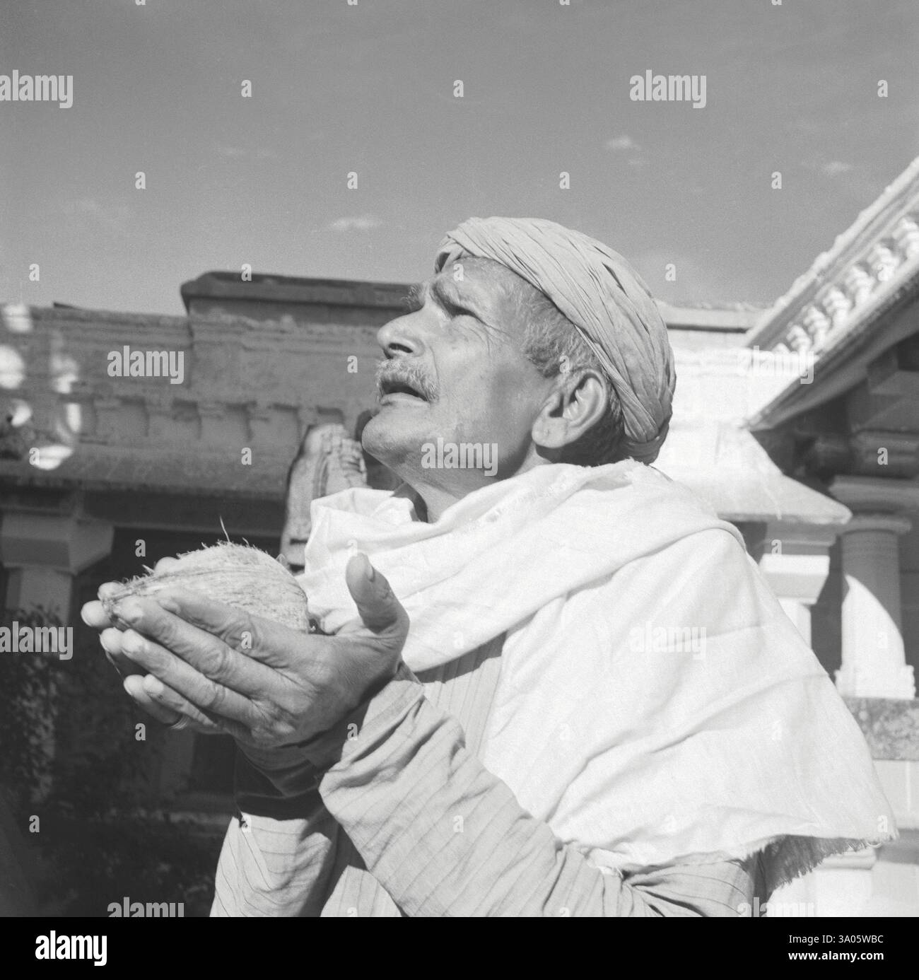 Man doing worship of Gomateshwara Idol (Lord Bahubali) idol, Sacred ...