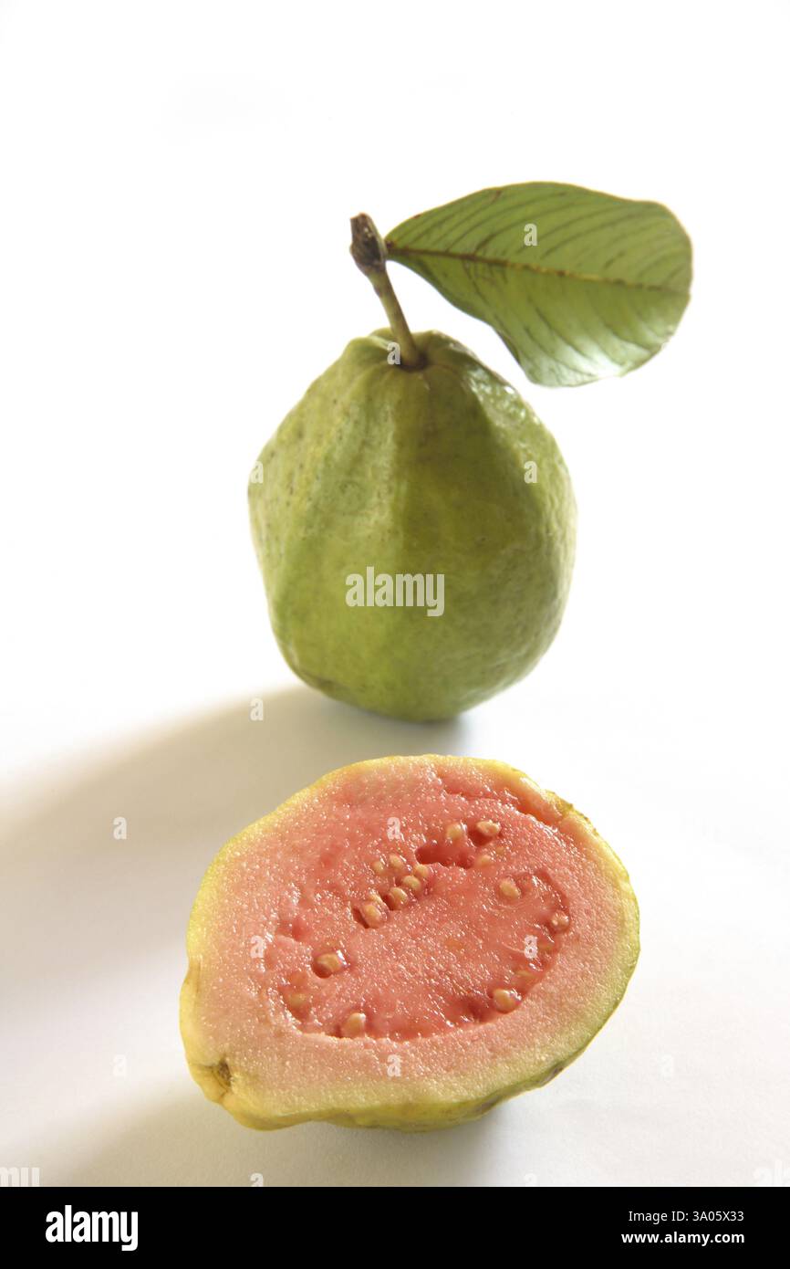 Fruits, amrood one full and half guava psidium guyava with green leaf ...