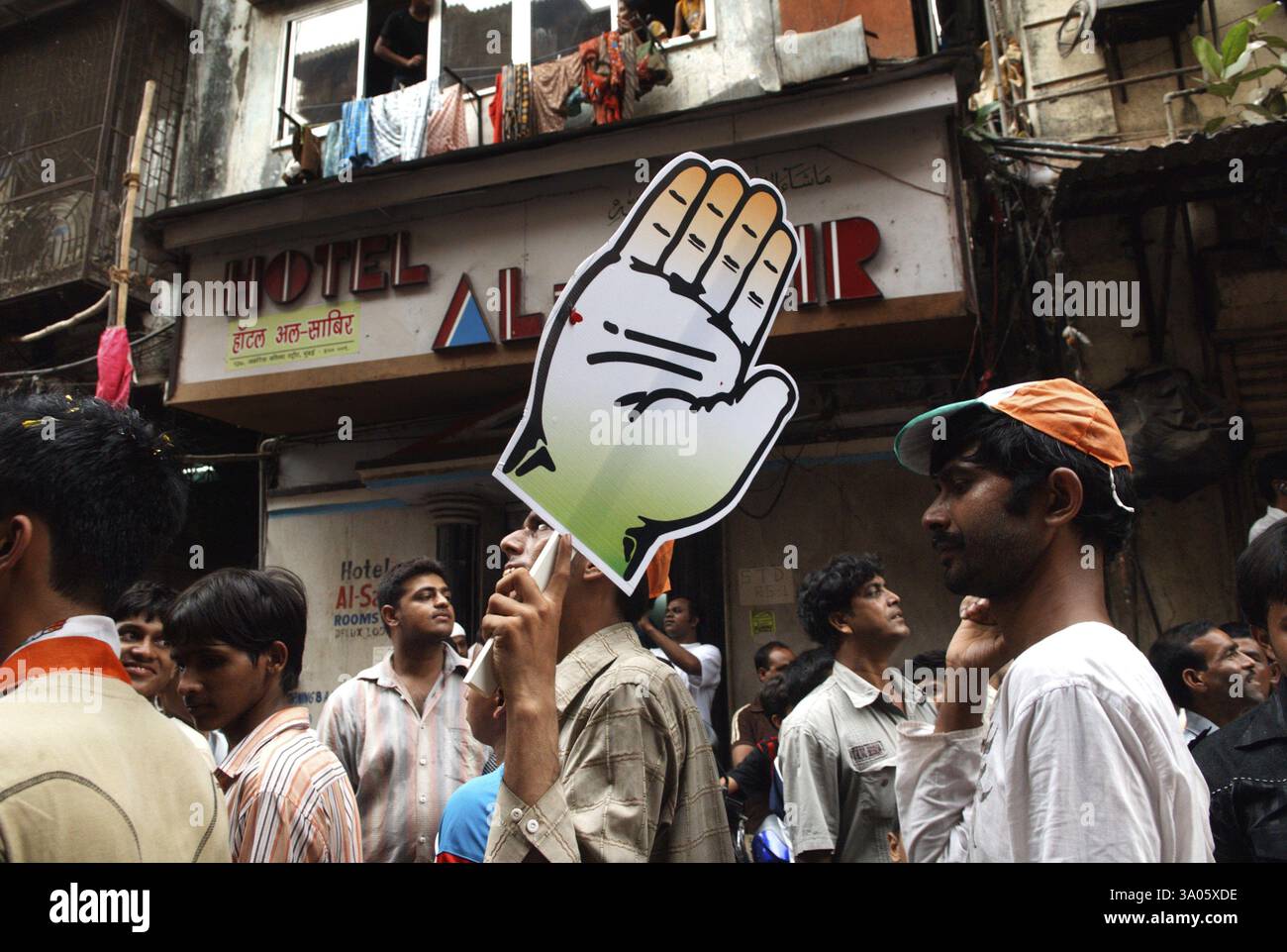 Supporter of Indian National Congress party carrying party symbol of ...