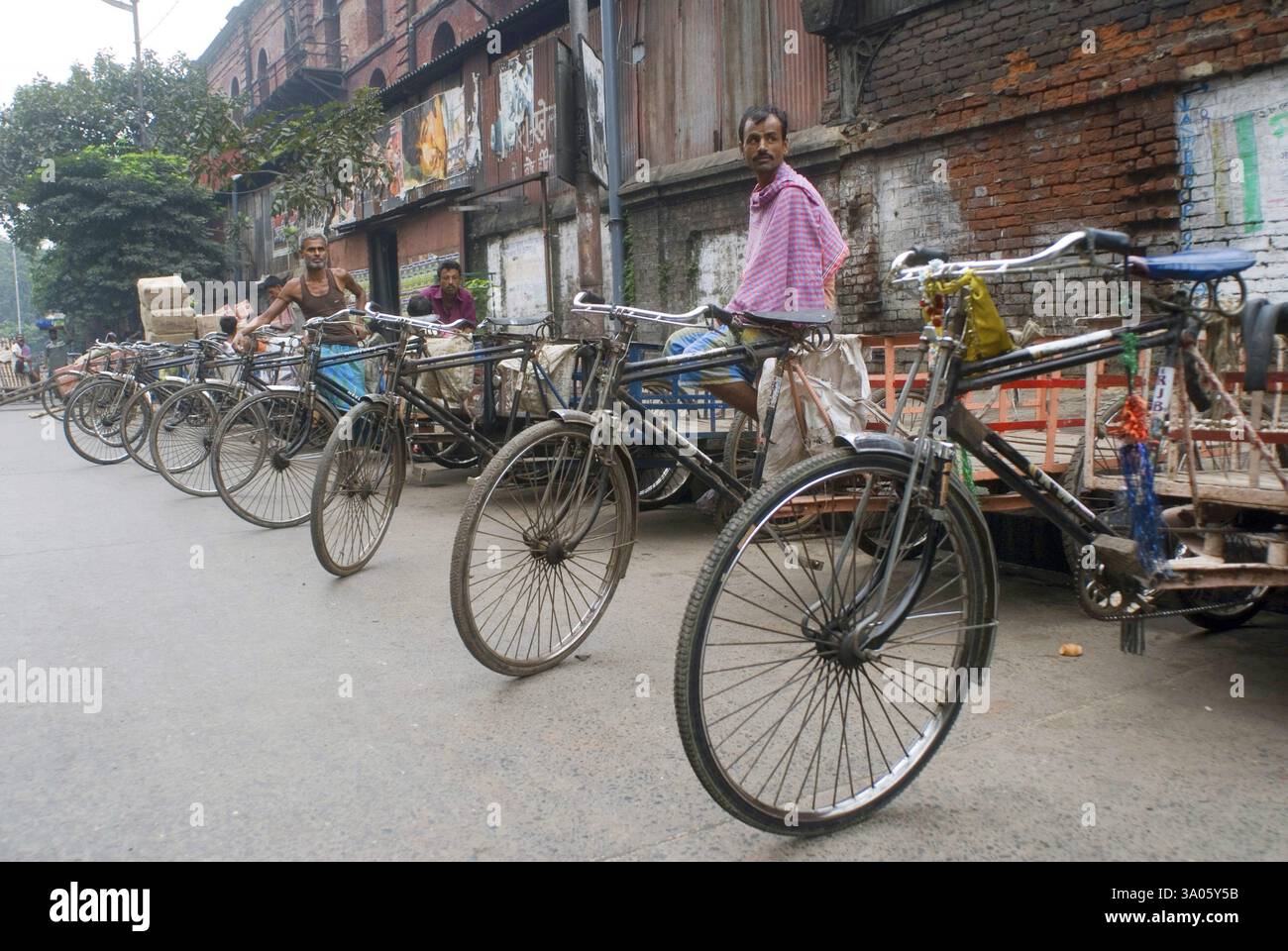 Cycle Rickshaw Riders on street waiting for passenger, Kolkata, West ...