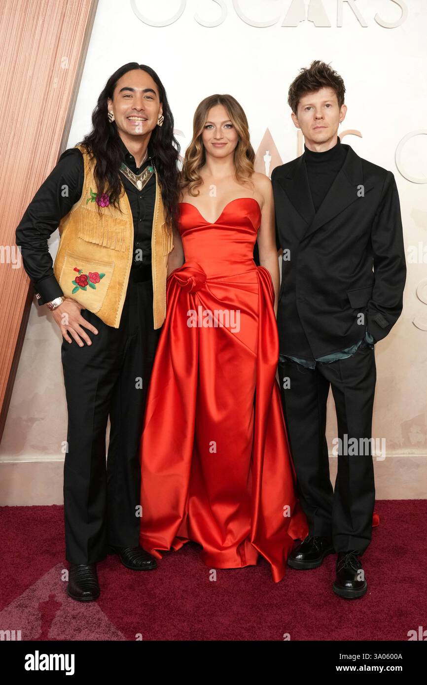 Julian Brave NoiseCat, from left, Emily Kassie, and Kellen Quinn arrive at the Oscars on Sunday ...