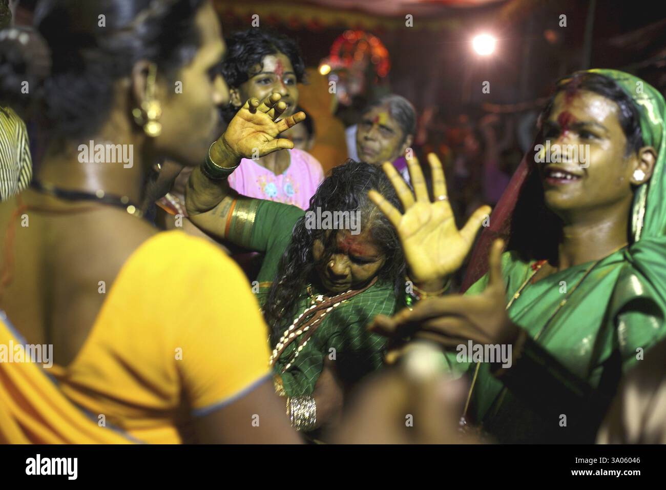 Eunuchs dressed in finery dancing during wedding of eunuchs on occasion ...