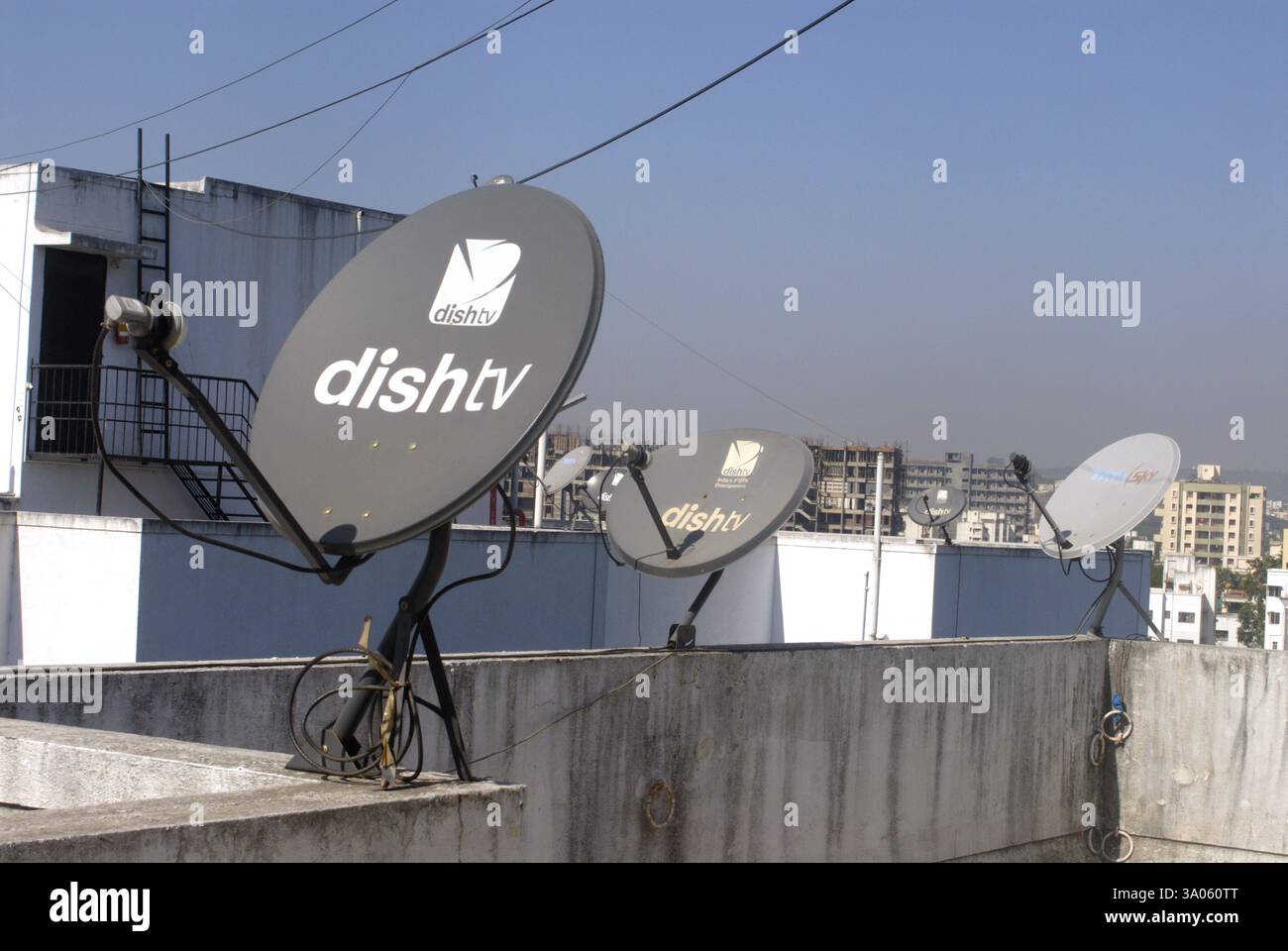 Dish Antennas for satellite television fixed on terrace of housing complex at, Pune, Maharashtra ...
