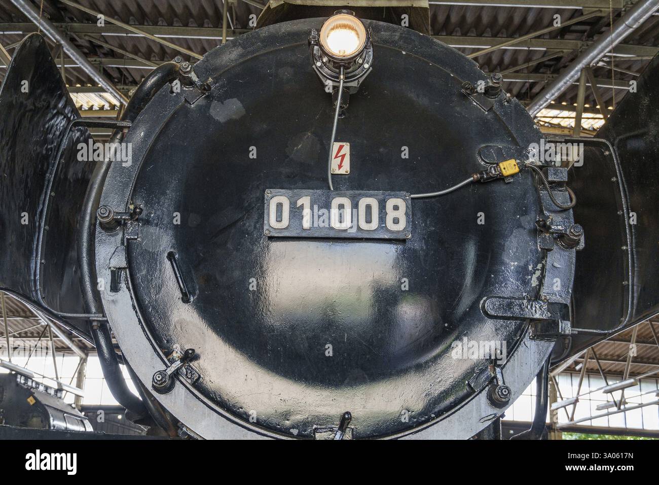 Front view of a black steam locomotive with number 01008, industrial atmosphere, Bochum, North ...