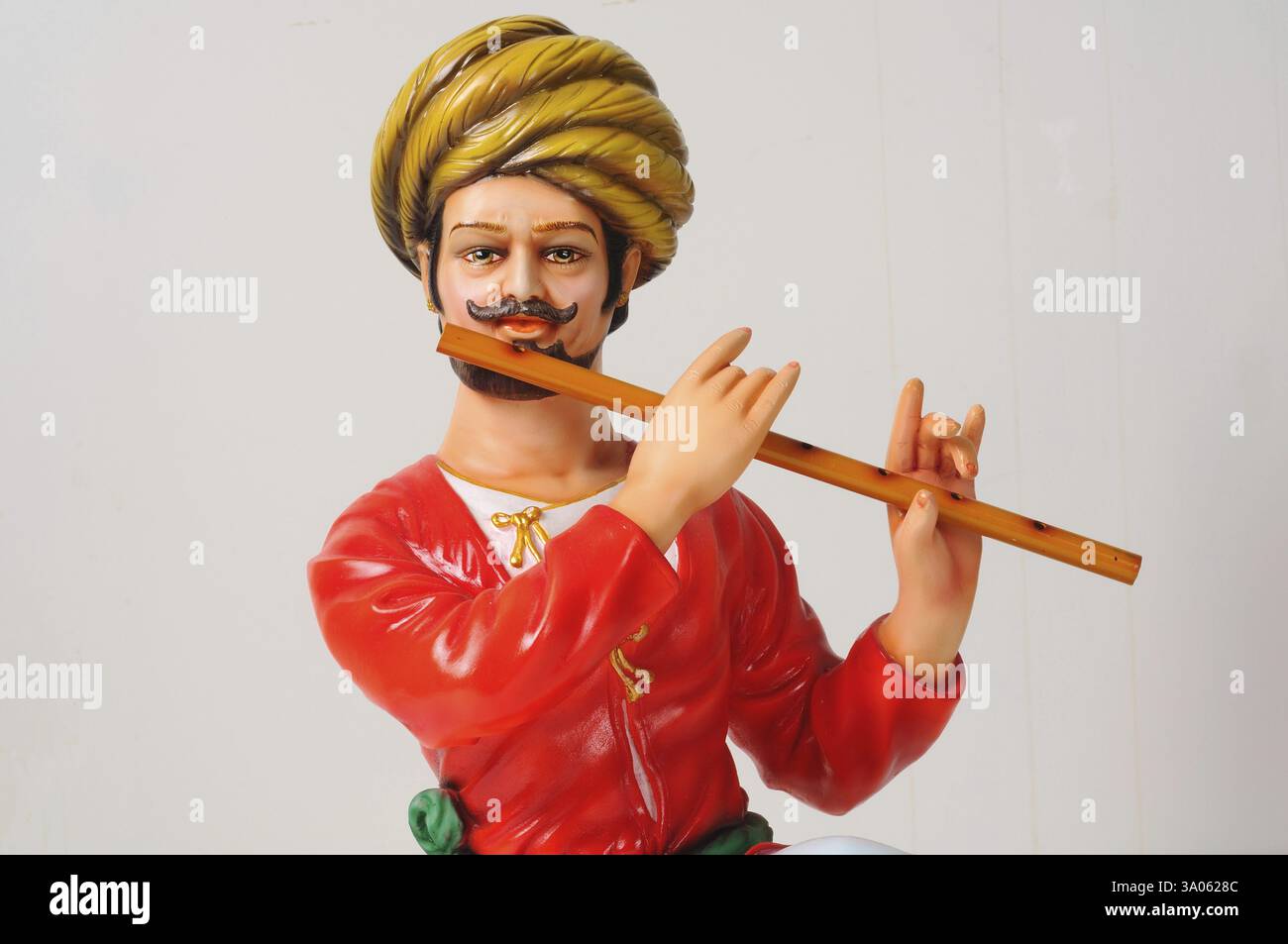 Clay figurine, statue of rajasthani musician playing flute Stock Photo ...