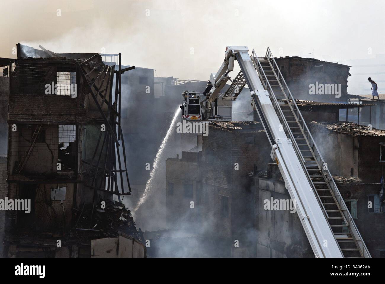 Firefighters dousing fire using snorkel in Behrampada slums, Bandra ...