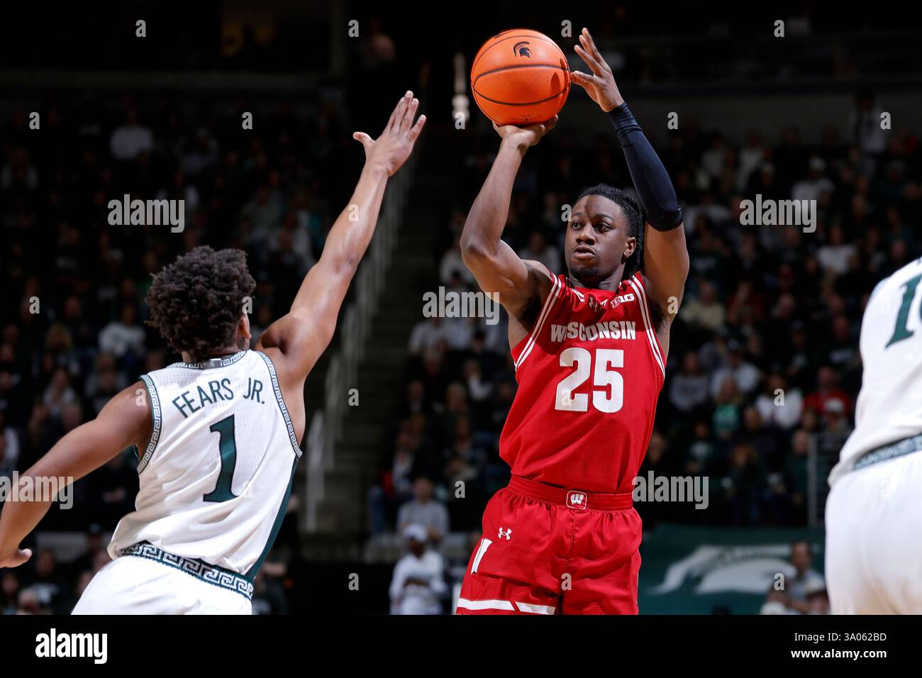 Wisconsin guard John Blackwell (25) shoots against Michigan State guard ...