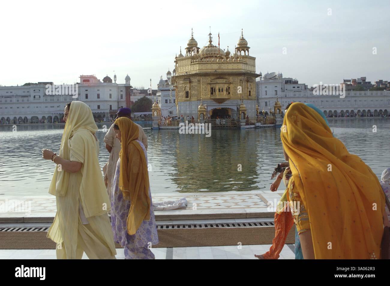 Sikh pilgrimage walks at Amrit sarovar, Golden temple, Amritsar, Punjab ...