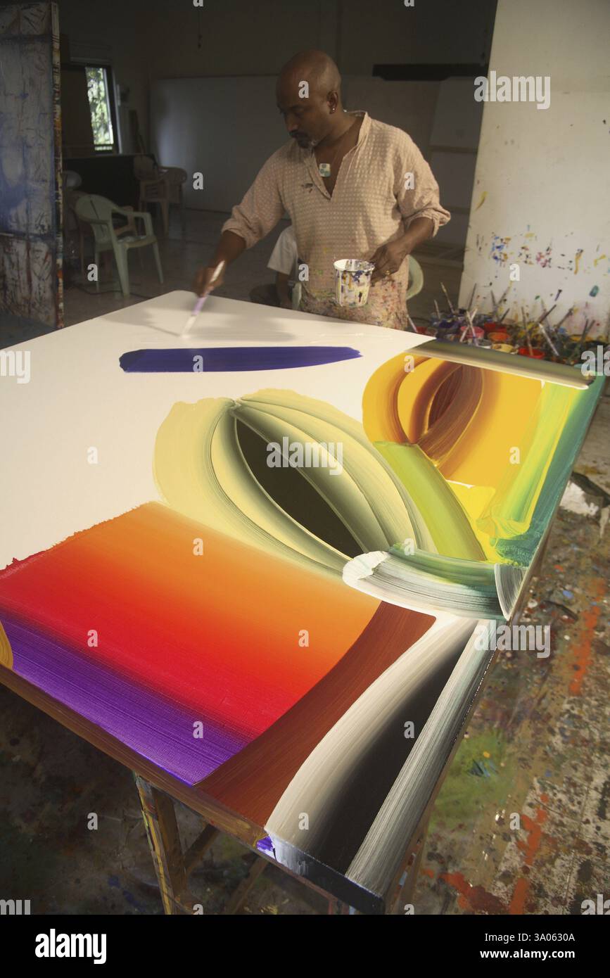 Indian contemporary artist Bose Krishnamachari in his studio working on ...
