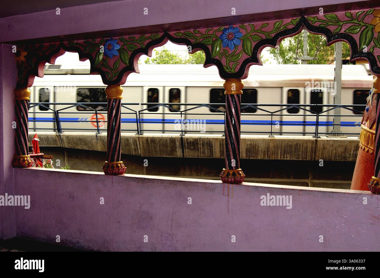 Metro train seen from inside of hanuman temple panchkuan road, New ...