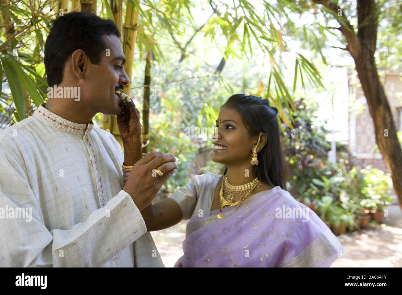 Bride feeding sweet to Bridegroom in Court marriage, Mumbai Bombay ...