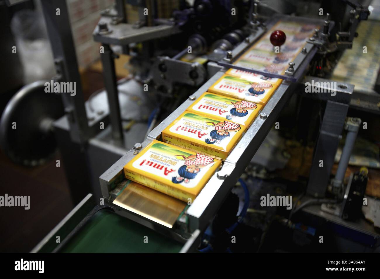 Packed Amul butter in wrappers coming out in Amul factory in Anand ...