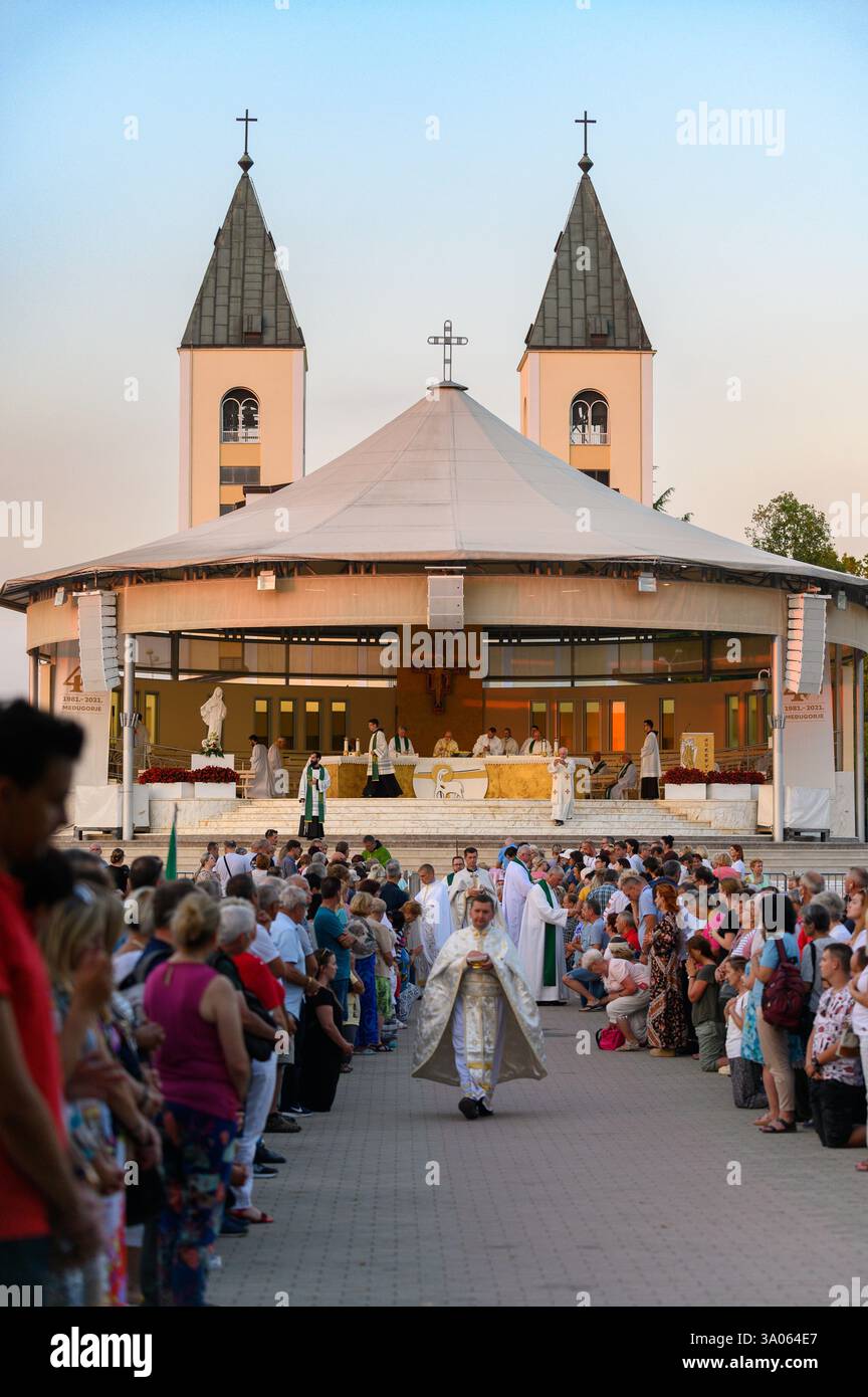 Priests distributing Holy Communion during Holy Mass in Medjugorje, BiH ...