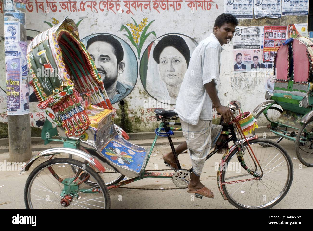Cycle Rickshaw Rider Passing Near at Wall Painting Of Political Graffiti, Dhaka, Bangladesh ...