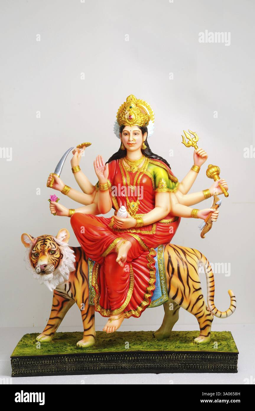 Clay statue of goddess maa durga mounted on tiger Stock Photo - Alamy