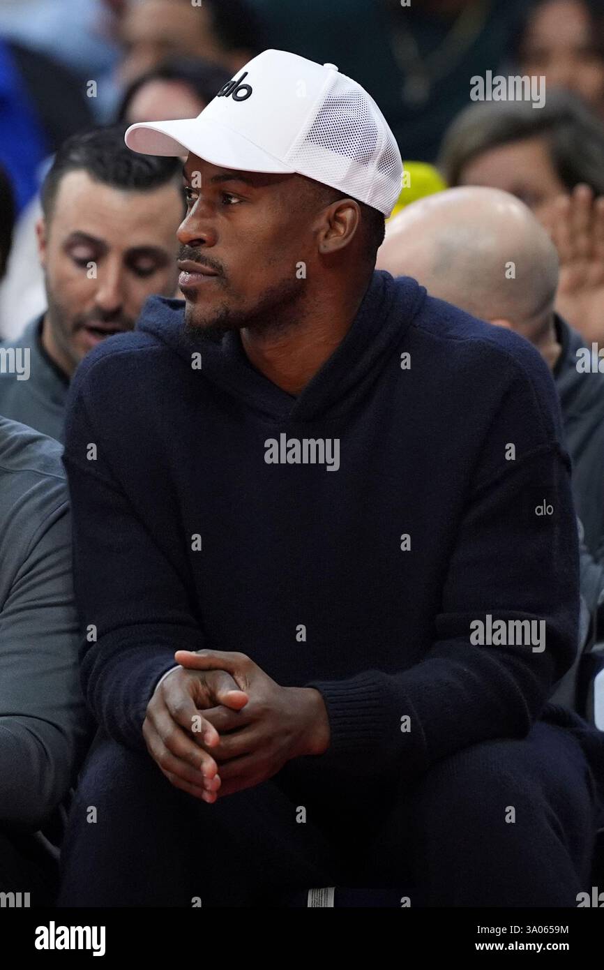 Golden State Warriors' Jimmy Butler III watches an NBA basketball game ...