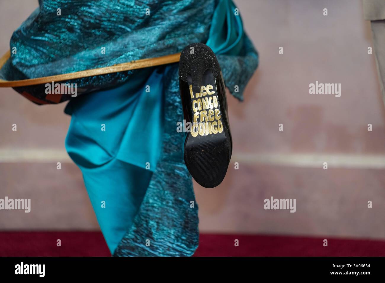 Kayo Shekoni shows the bottom of her shoe as she arrives at the Oscars ...