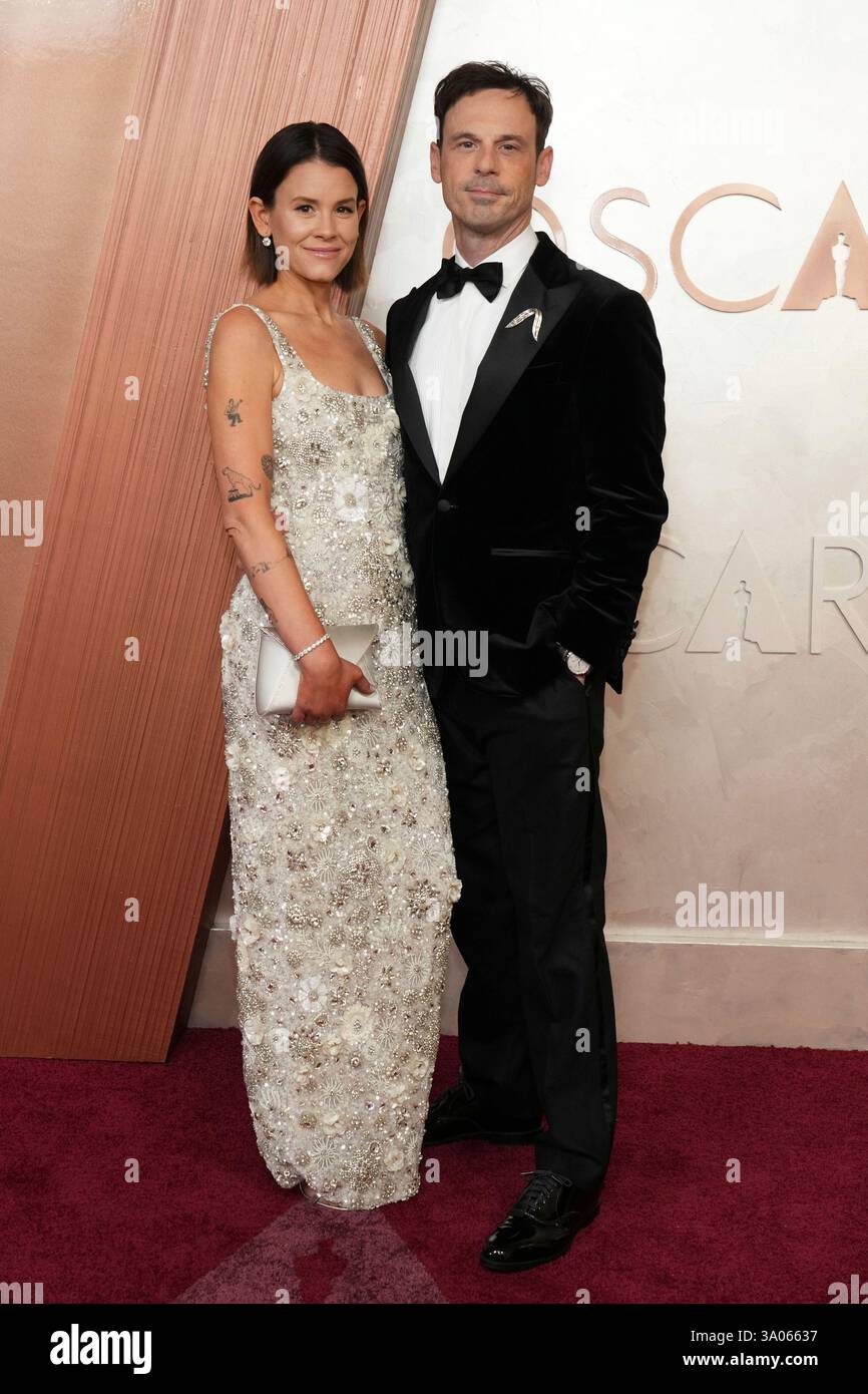 Sosie Bacon, left, and Scoot McNairy arrive at the Oscars on Sunday ...