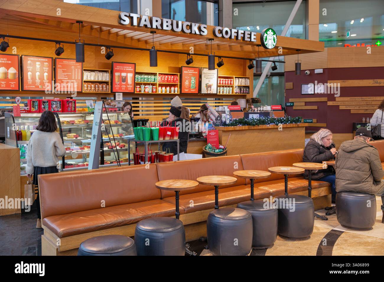 Iasi, Romania - December 26, 2024: People visit Starbucks Coffee shop ...
