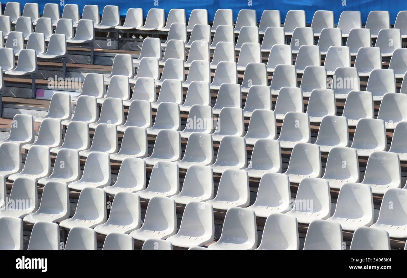 Empty white stadium seats. Outdoor plastic spectator chairs Stock Photo ...