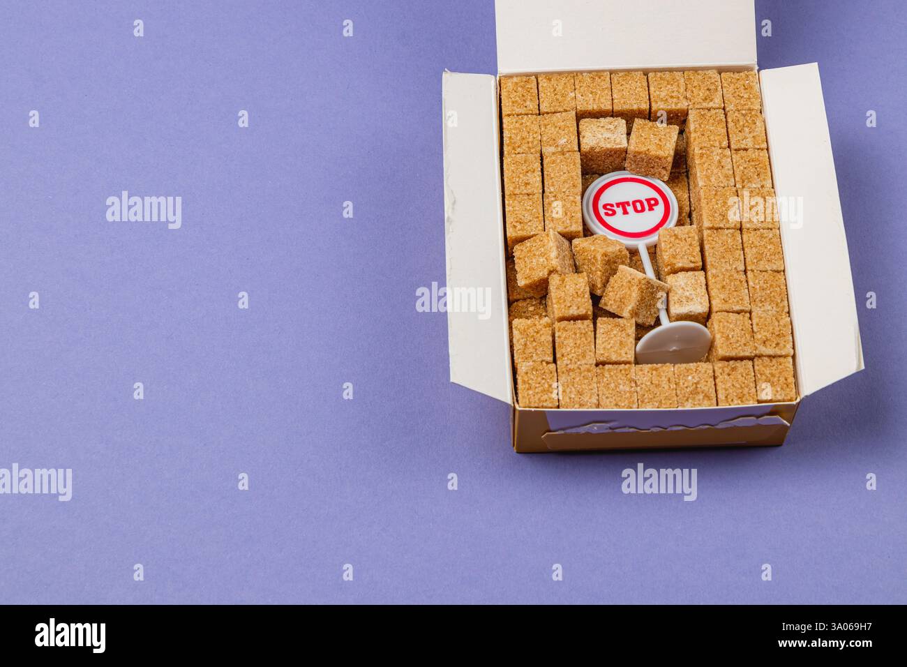 A unique arrangement of brown sugar cubes is presented in a small box ...