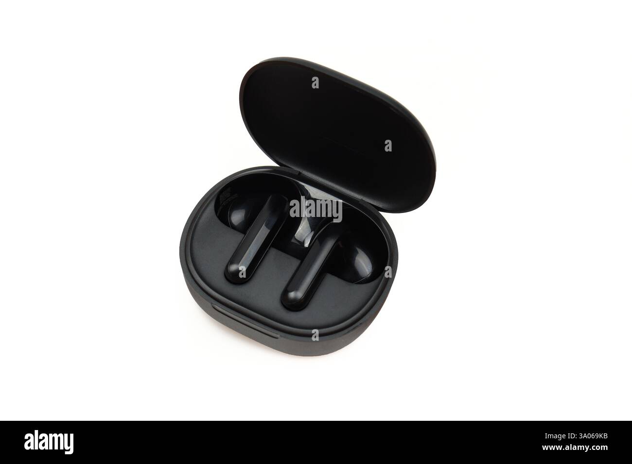 Wireless earbuds in black case isolated on white background Stock Photo ...