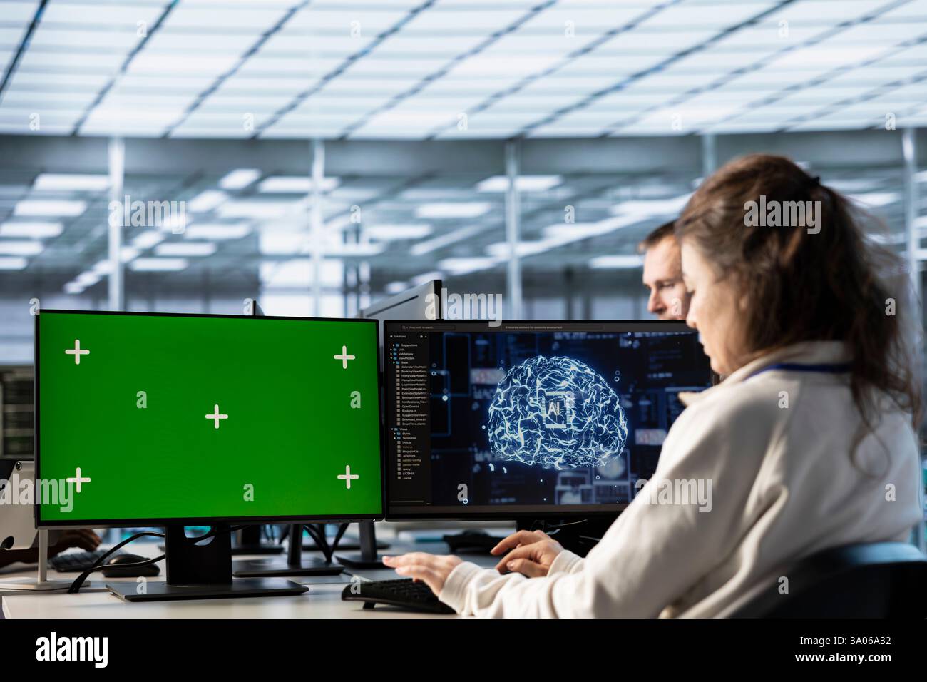 Woman in AI data center coding on green screen computers, upgrading equipment. IT engineers at ...
