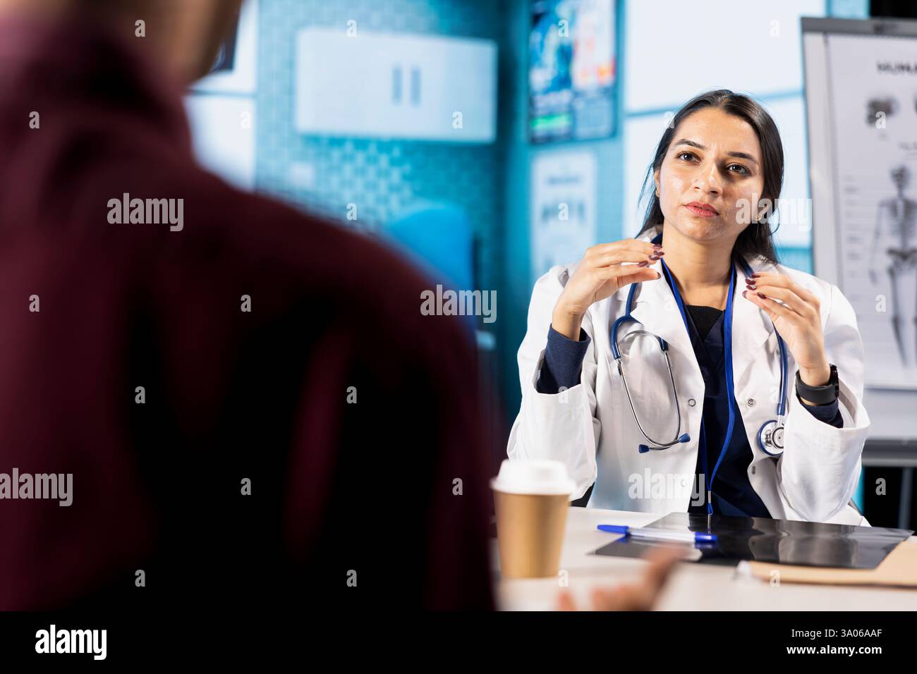 Indian expert explaining diagnostics through test results with a male ...