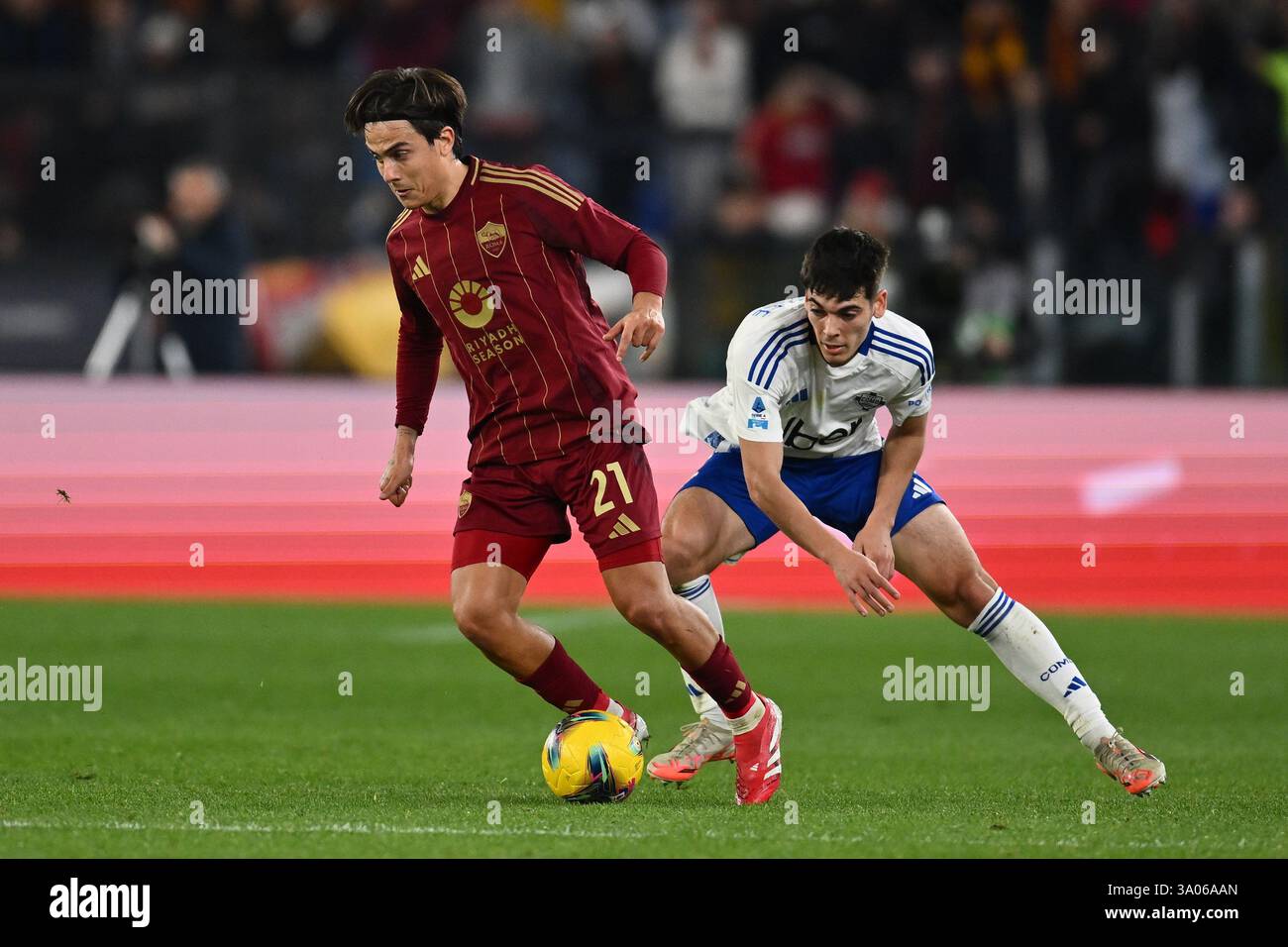 Rome, Italy. 02nd Mar, 2025. Paulo Dybala of A.S. Roma and Álex Valle of Como 1907 are in action ...