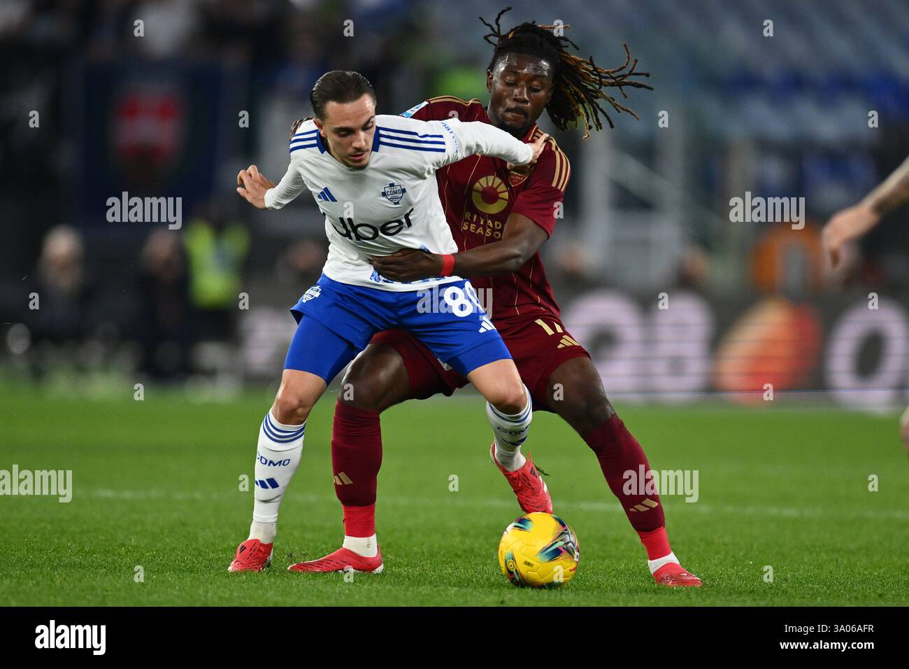 Maxence Caqueret of Como 1907 and Manu Kone of A.S. Roma are in action ...