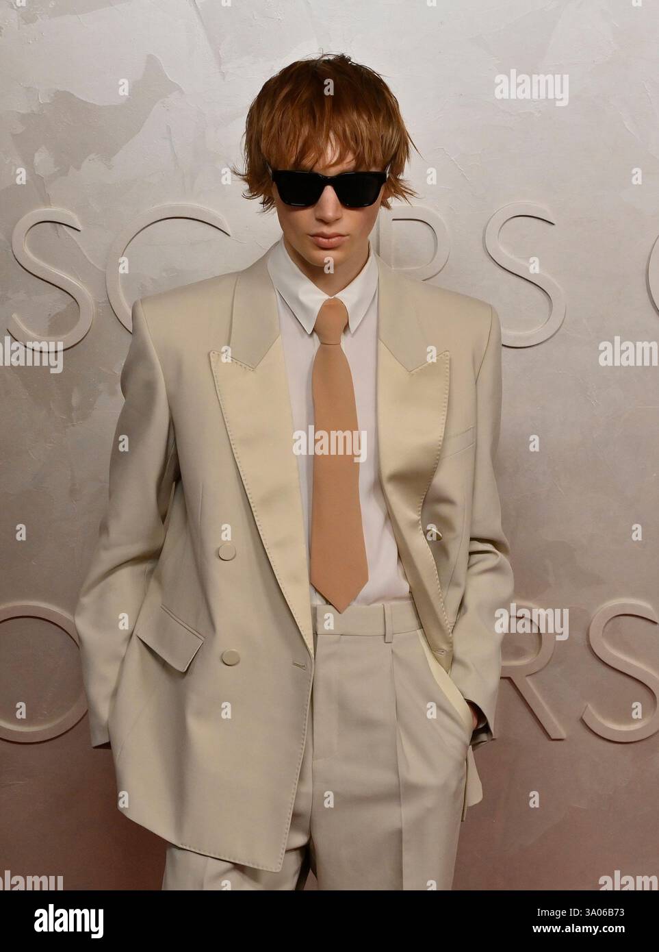 Callum Harper arrives on the red carpet for the 97th Academy Awards in ...