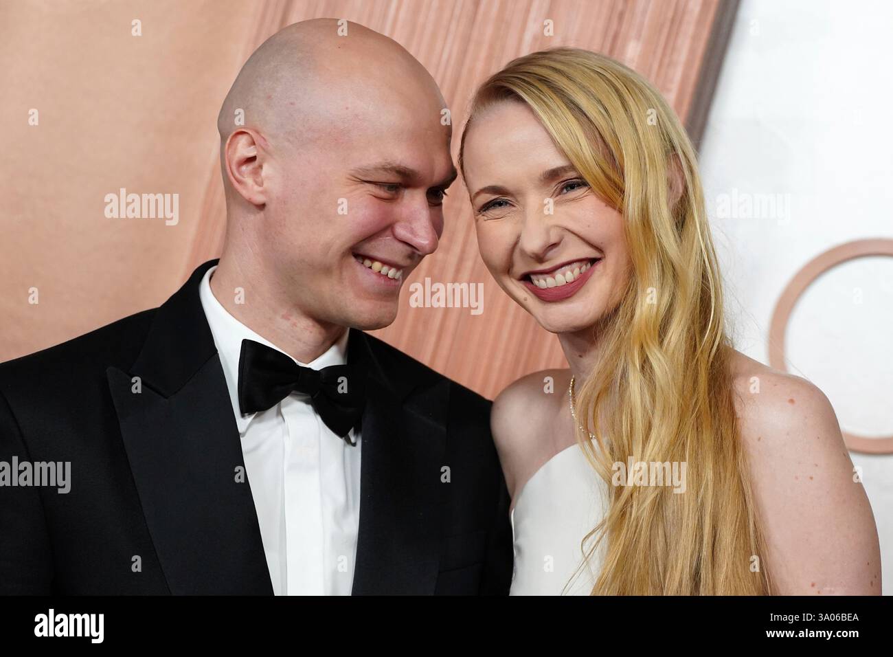 Yura Borisov, left, and Anna Borisova arrive at the Oscars on Sunday ...