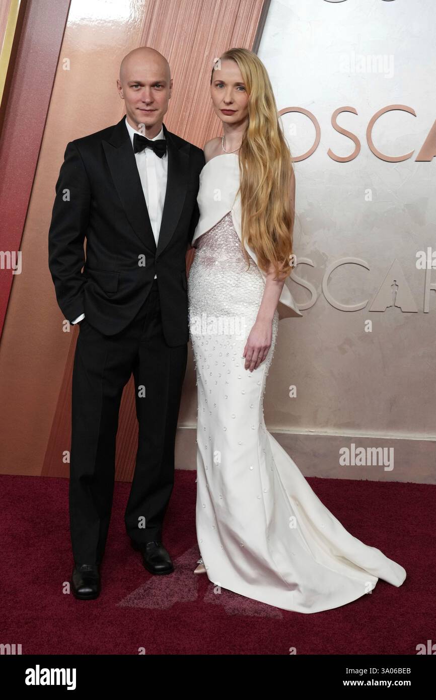 Yura Borisov, left, and Anna Borisova arrive at the Oscars on Sunday ...