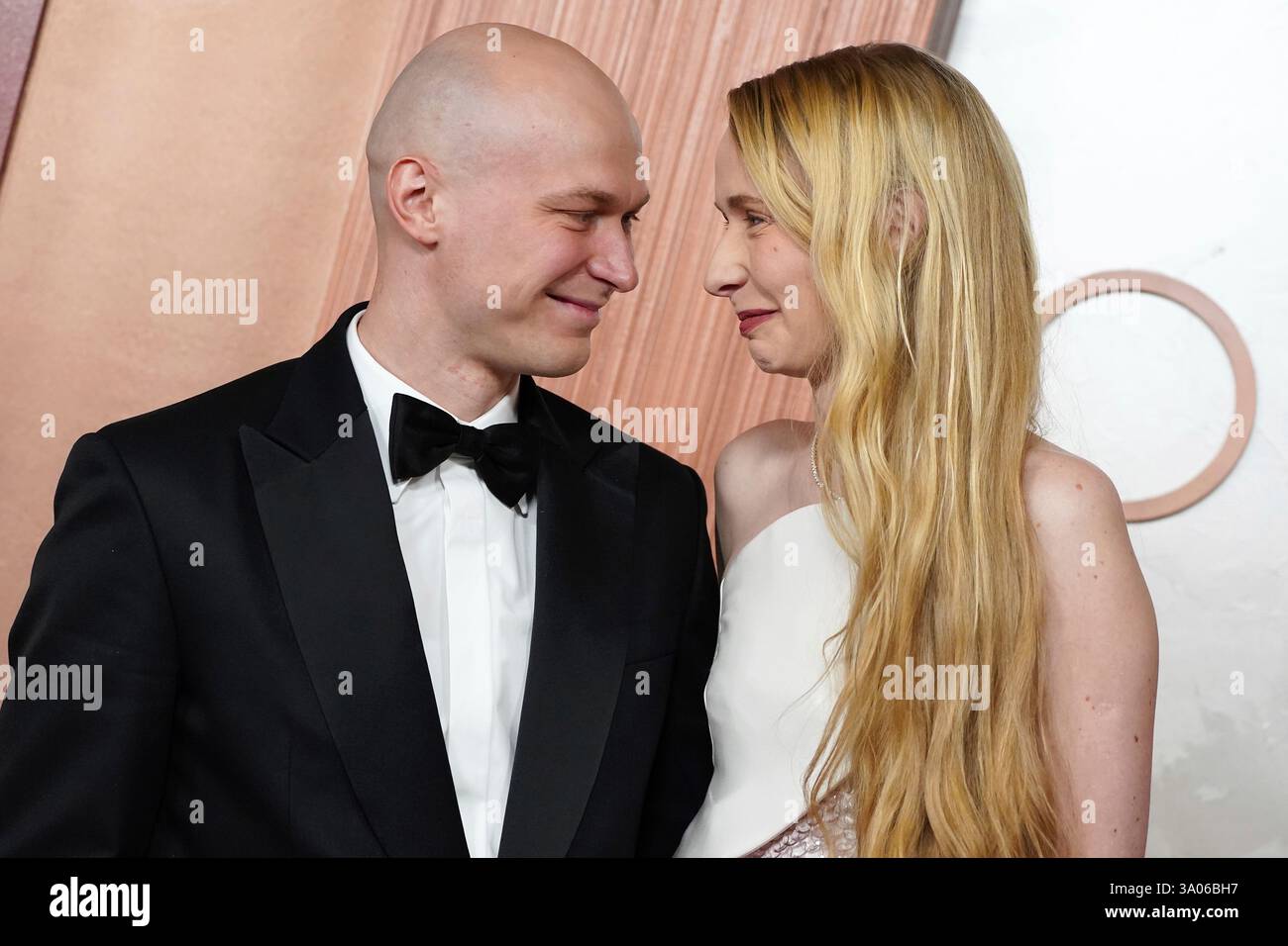 Yura Borisov, left, and Anna Borisova arrive at the Oscars on Sunday ...