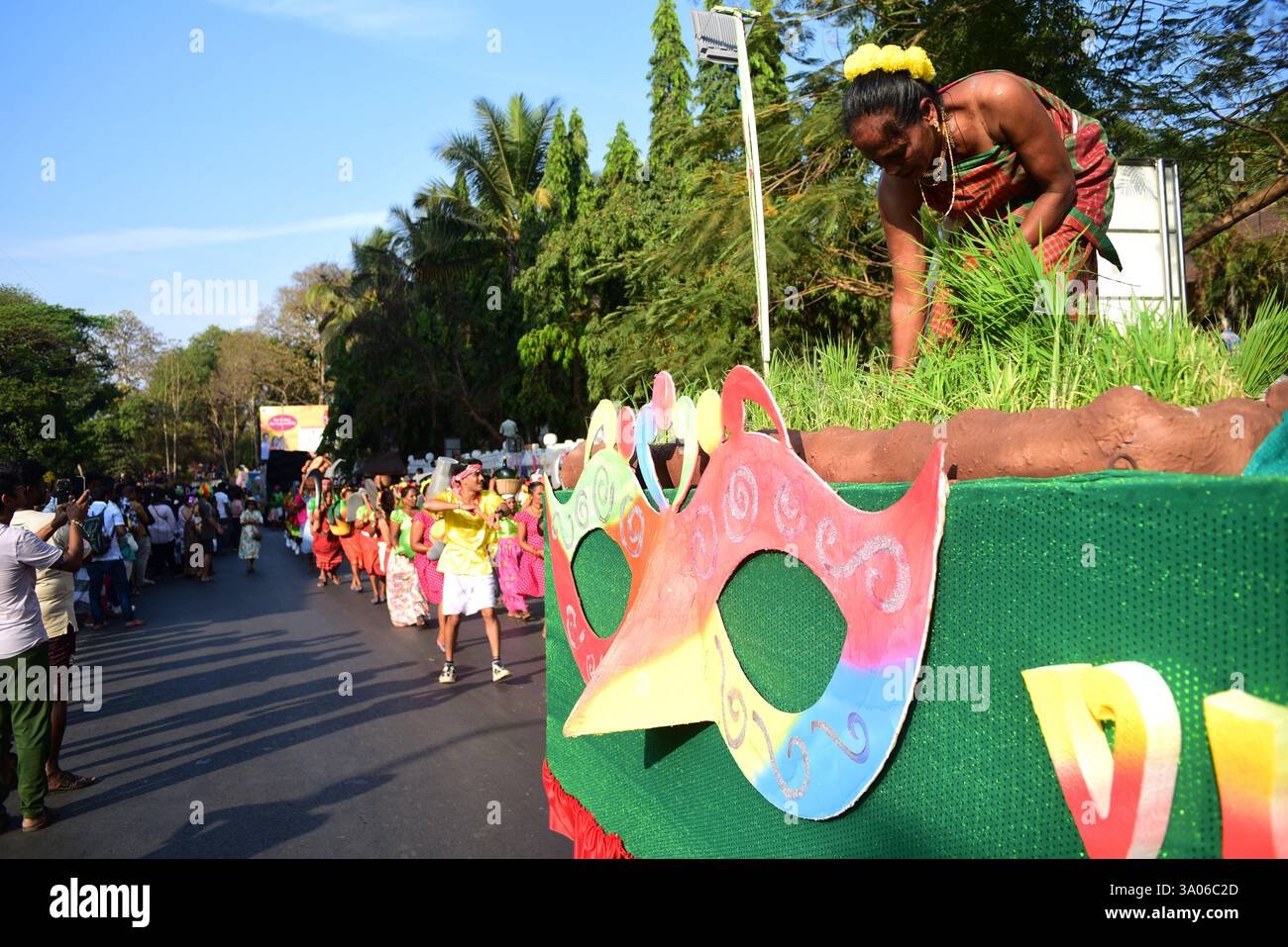 Omen seen removing the grass from the field in traditional attire and ...